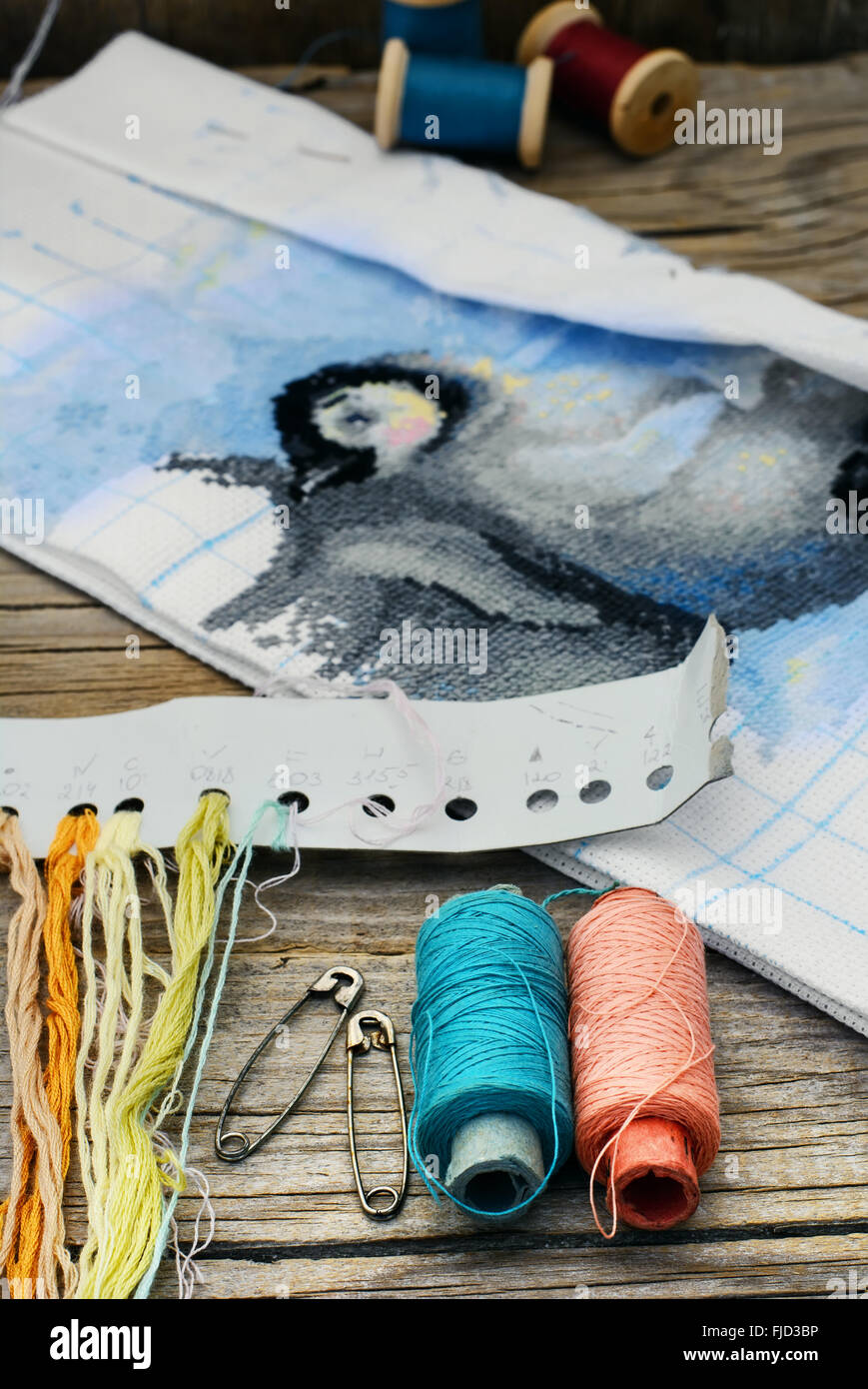 Set of threads for embroidery on background of handmade paintings Stock ...