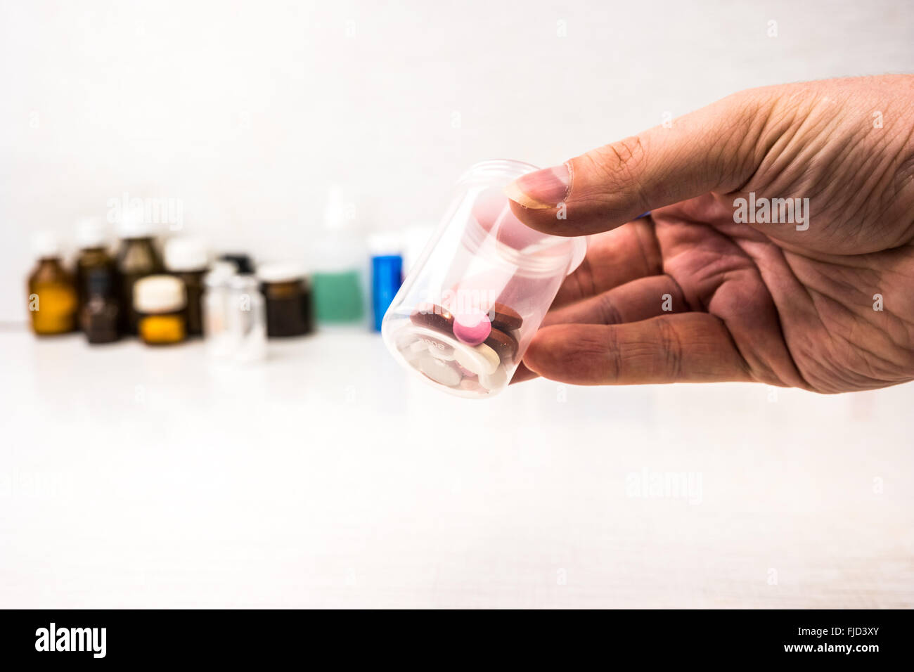 Drugs in a measuring cylinder Stock Photo - Alamy