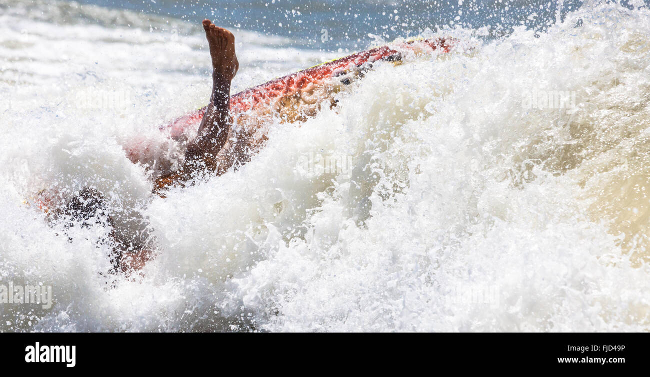 Fall into the sea during the surfing Stock Photo - Alamy