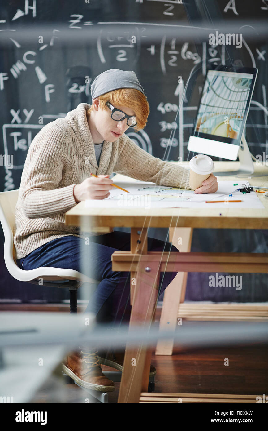 High school male student sitting by the desk at math class Stock Photo ...