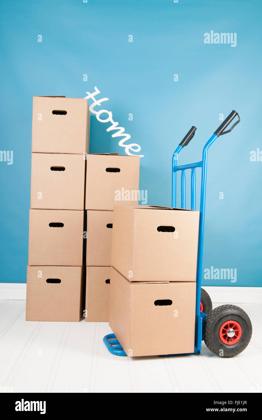 Removal house with boxes in interior Stock Photo - Alamy
