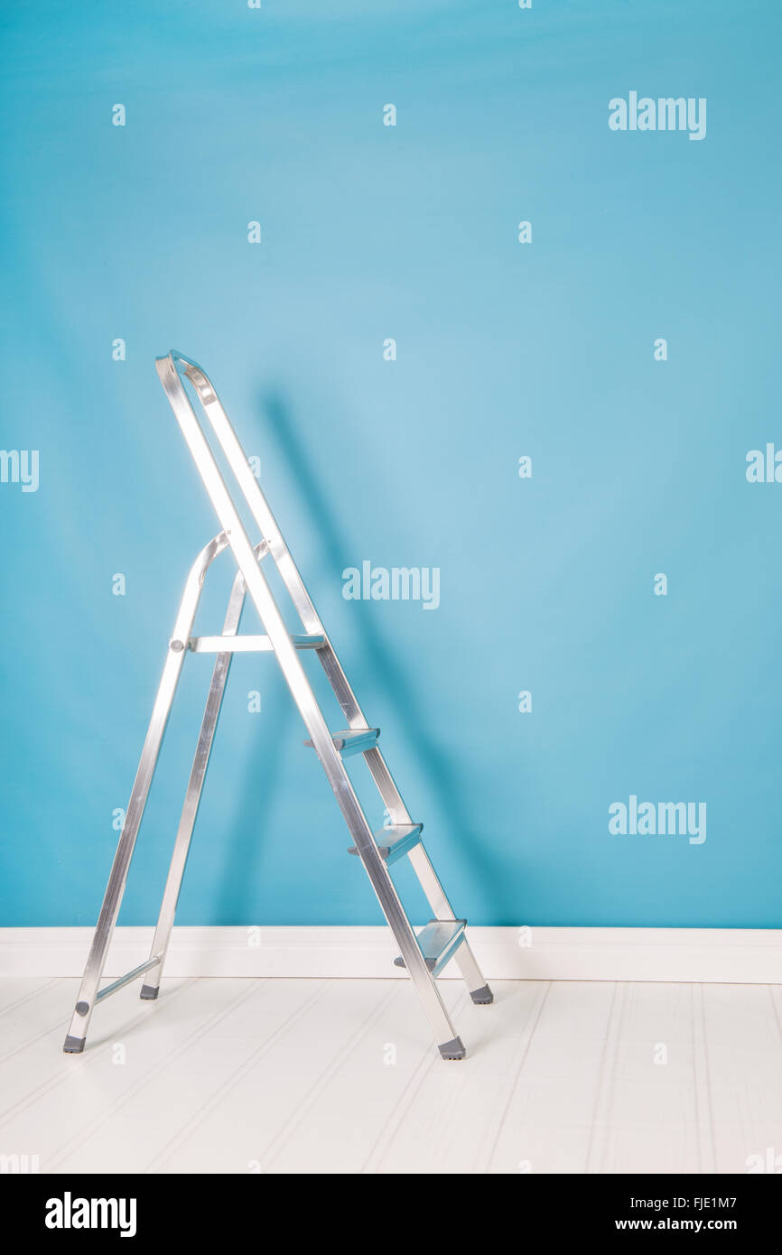 step ladder in blue interior Stock Photo - Alamy