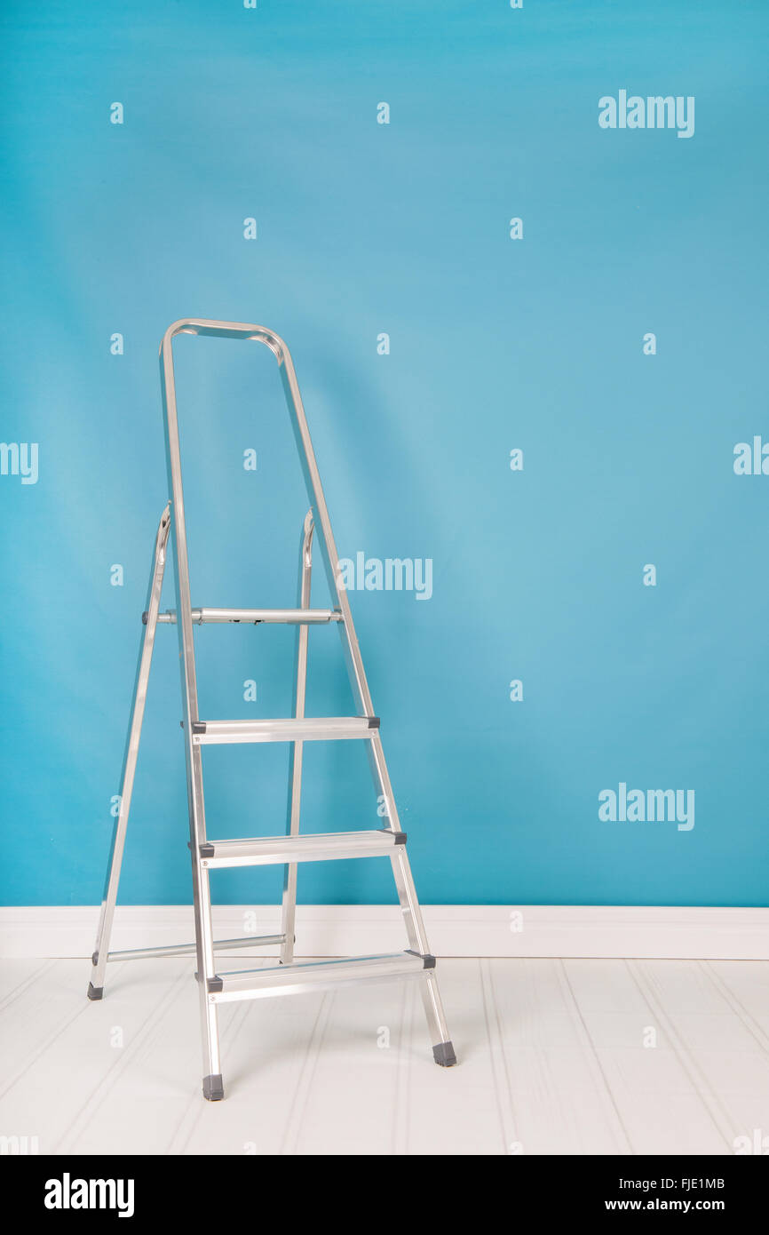 step ladder in blue interior Stock Photo - Alamy