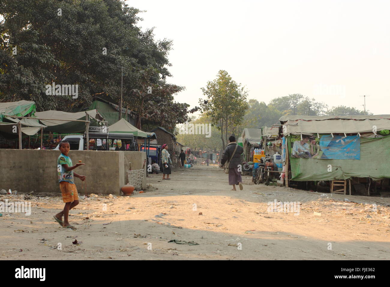 village in a slum area near the river in Mandalay, Myanmar Stock Photo ...