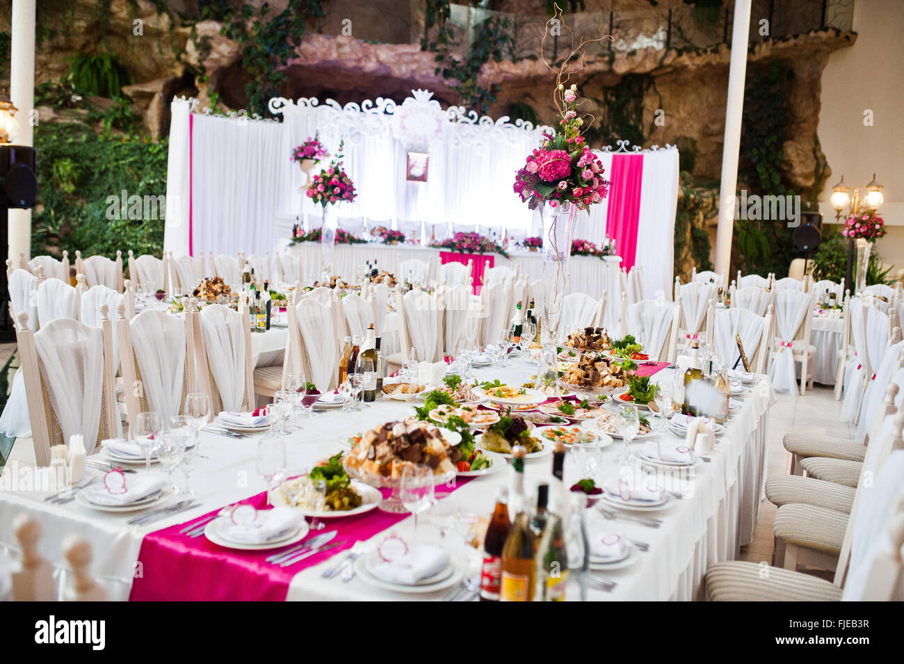 Amazing wedding table in pink style with flowers and foods Stock Photo ...