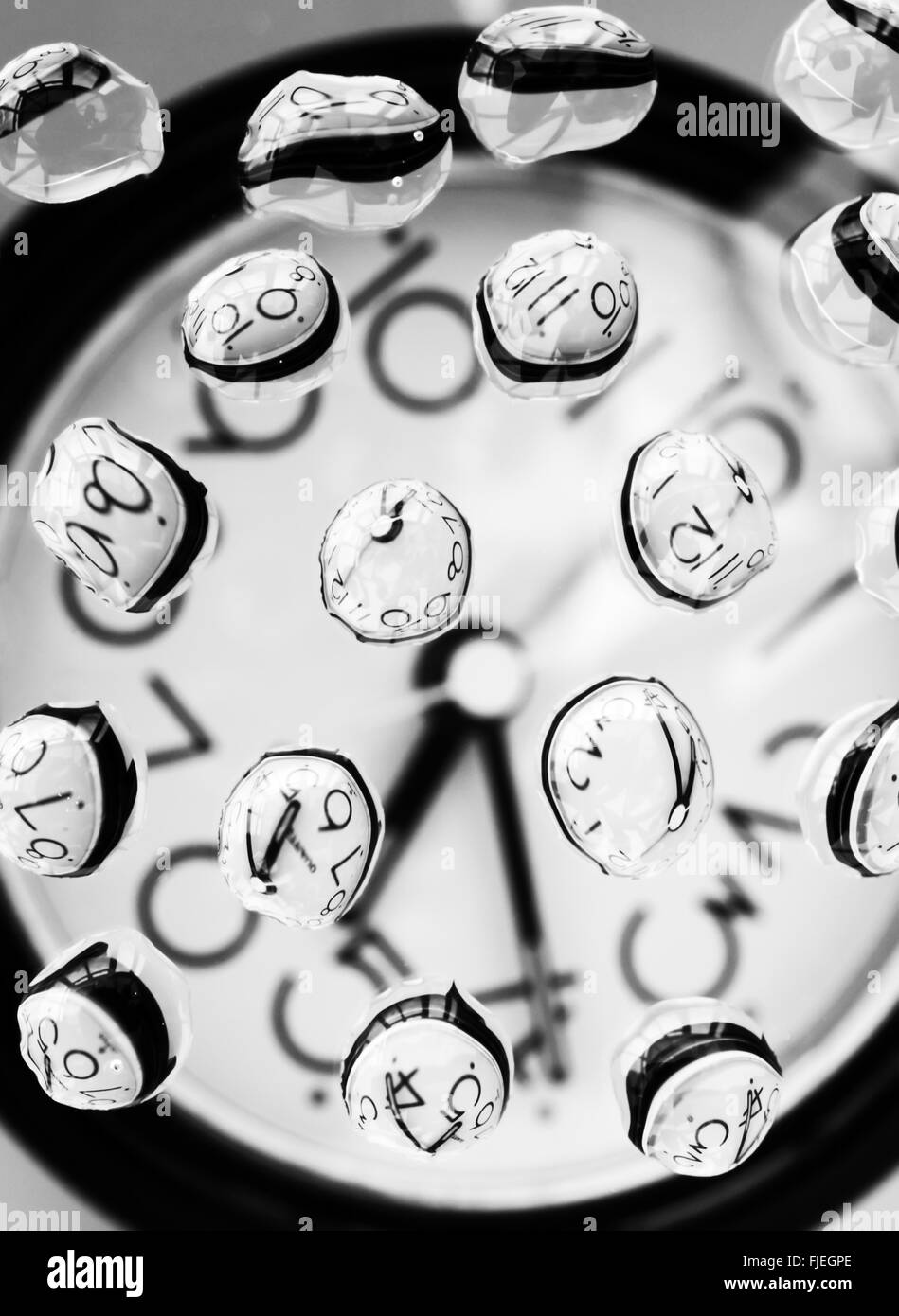 Close up of a clock face refracted in water drops Stock Photo - Alamy