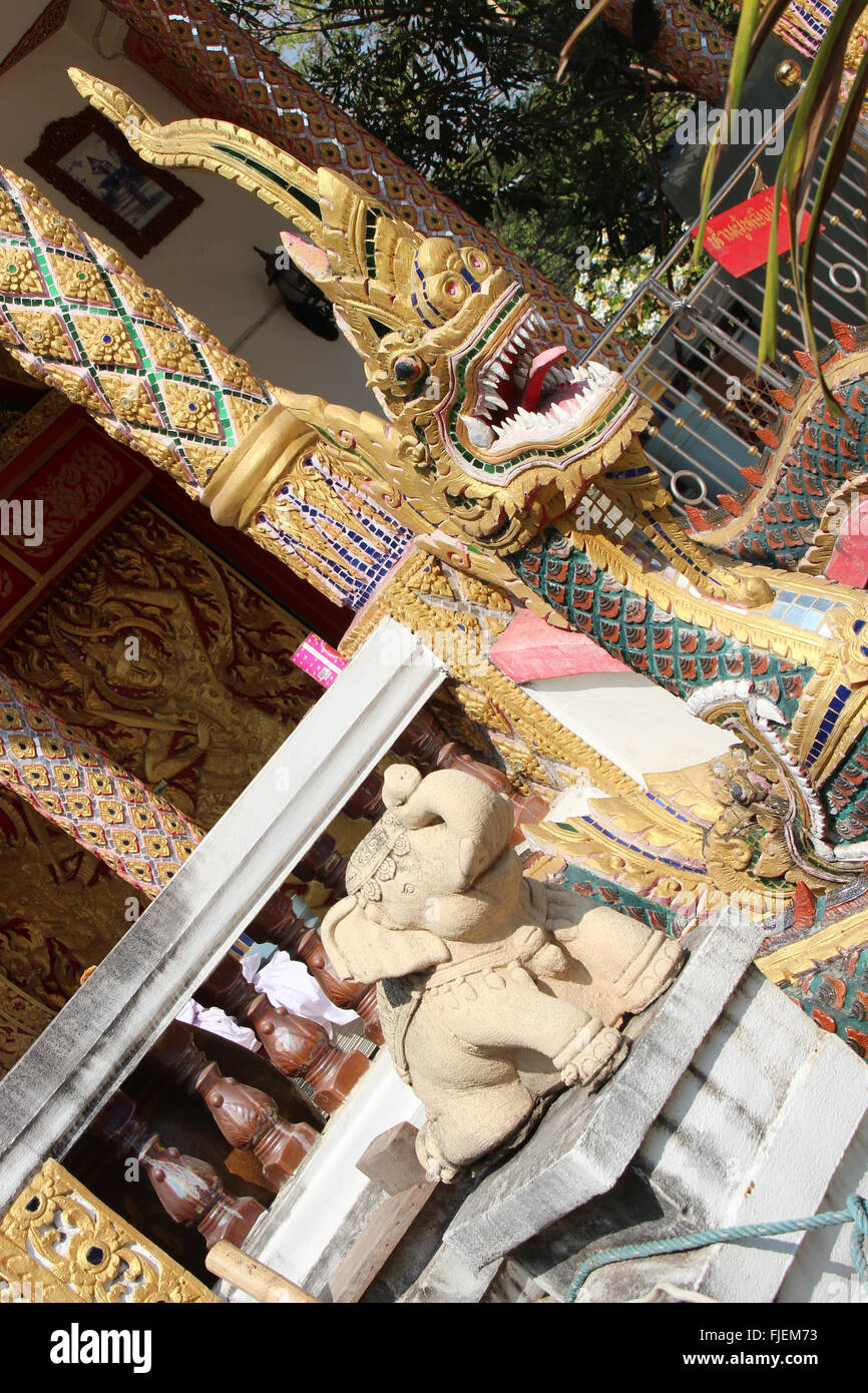 Statues of an elephant and a naga decorate the entrance of the Wat Lam ...