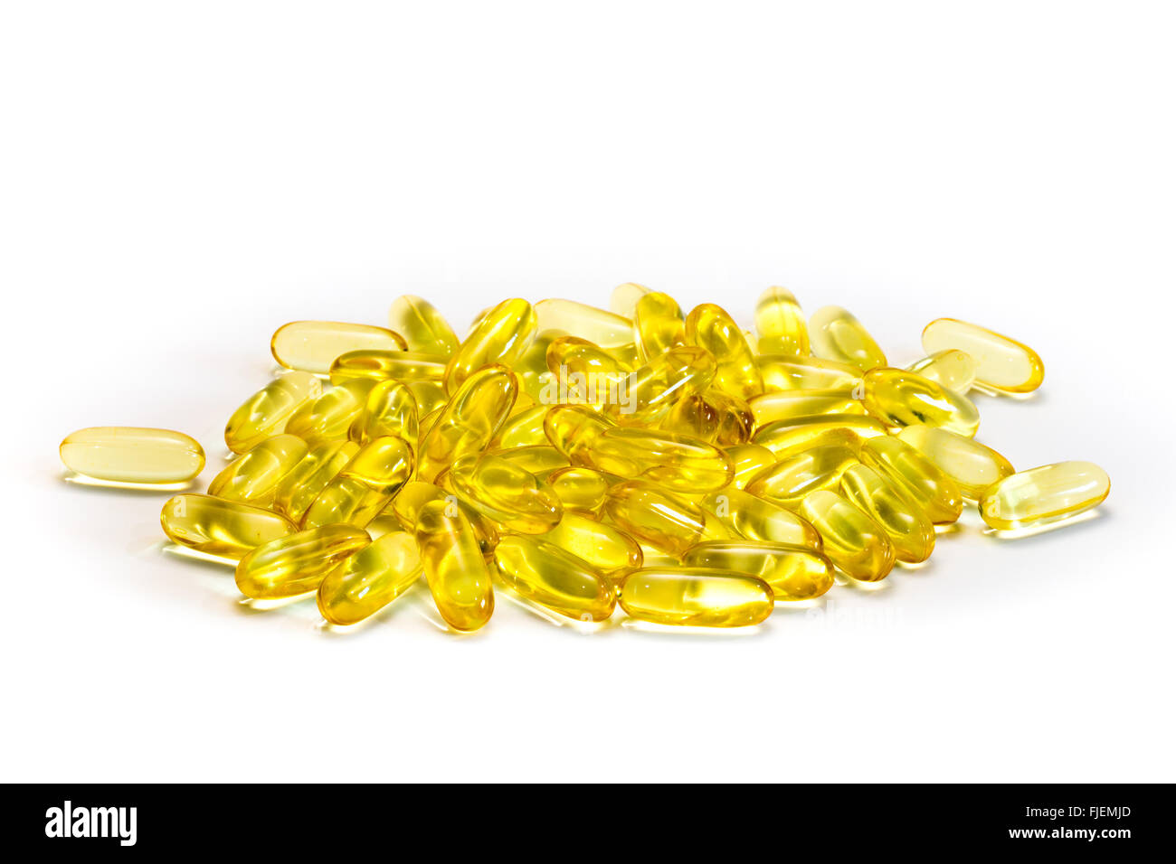Fish oil capsules closeup with white background Stock Photo - Alamy