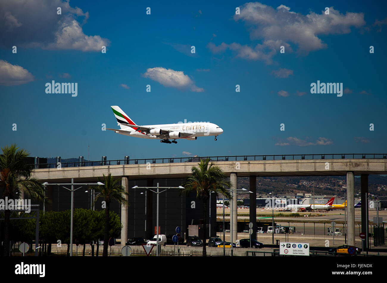 An Emirates aeroplane approaches Barcelona international airport Stock ...