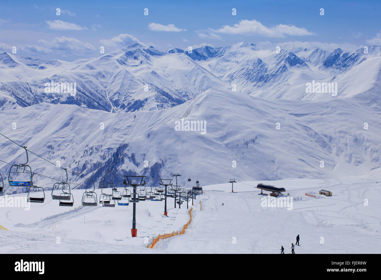 Panoramic view on ski station on snowy mountains background Stock Photo ...