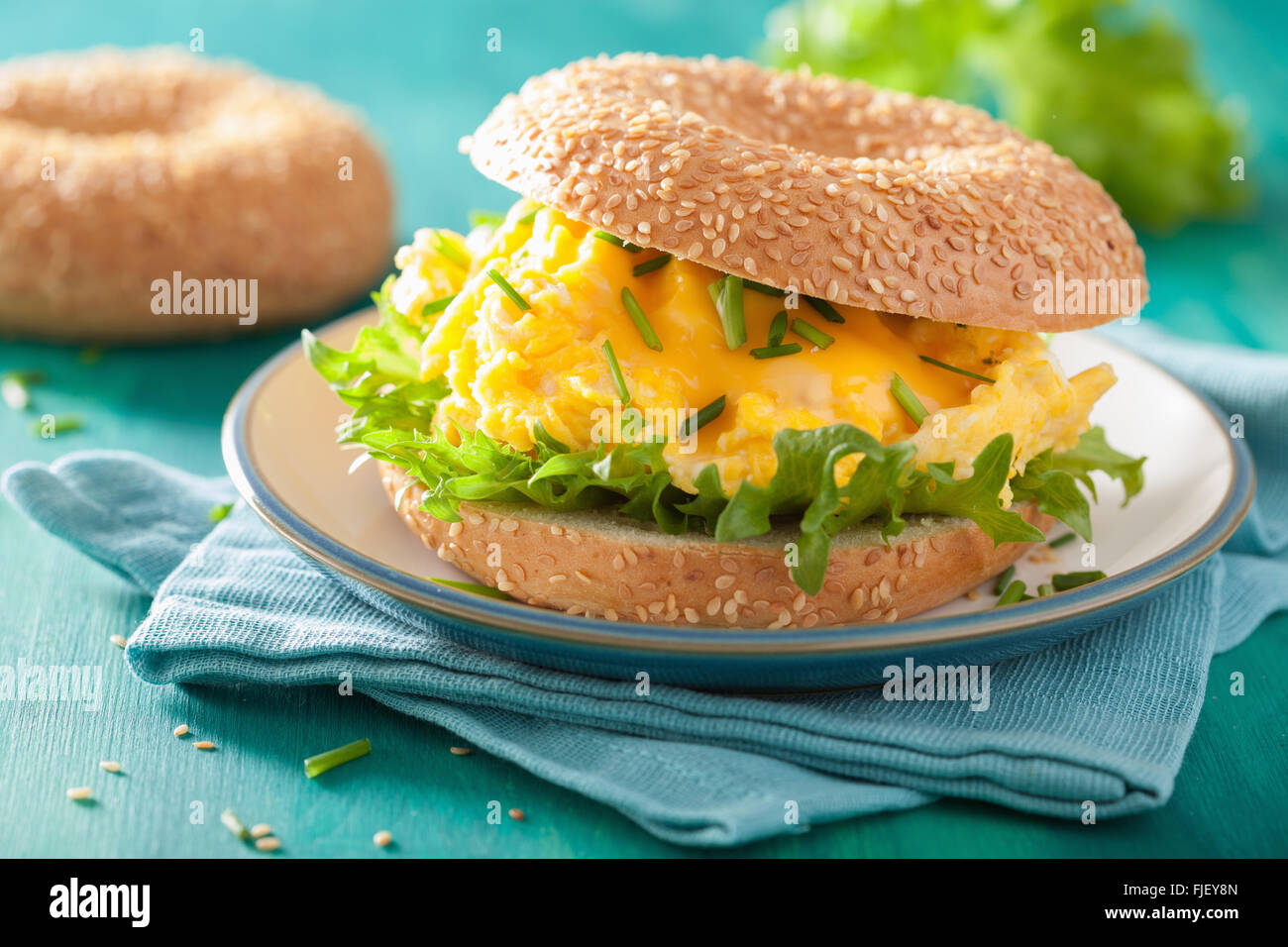 breakfast sandwich on bagel with egg cheese lettuce Stock Photo - Alamy