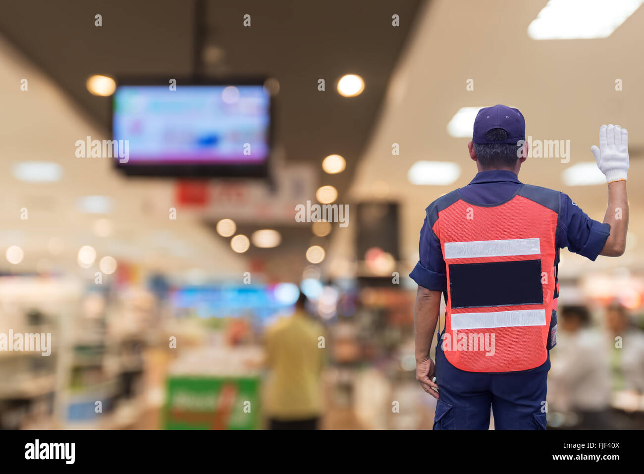 Security guard in shopping mall Stock Photo - Alamy