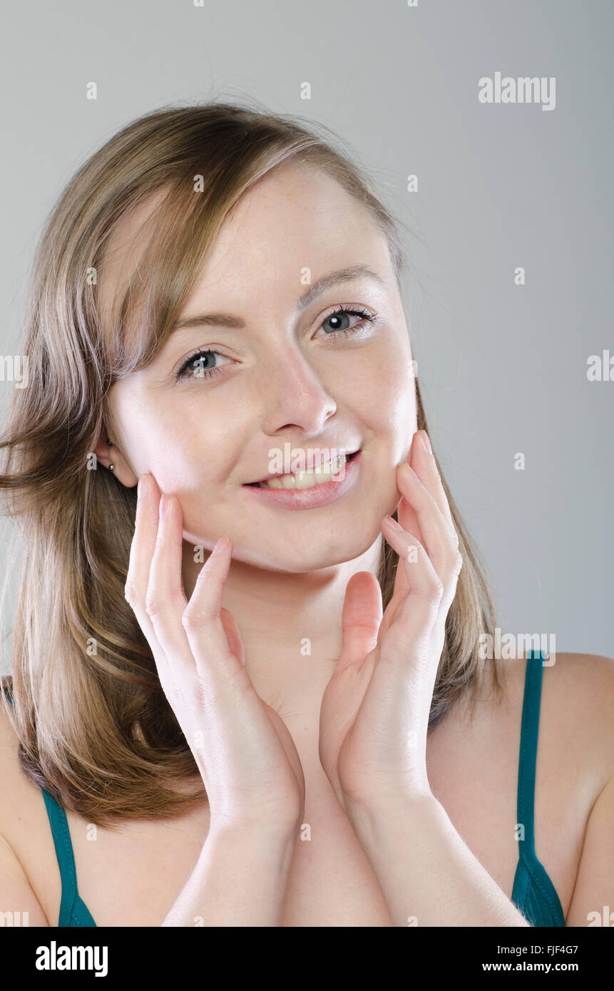Happy young woman smiling Stock Photo - Alamy