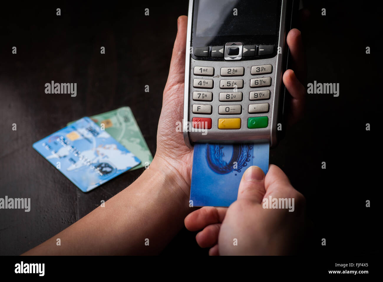 Color image of a POS and credit cards Stock Photo - Alamy