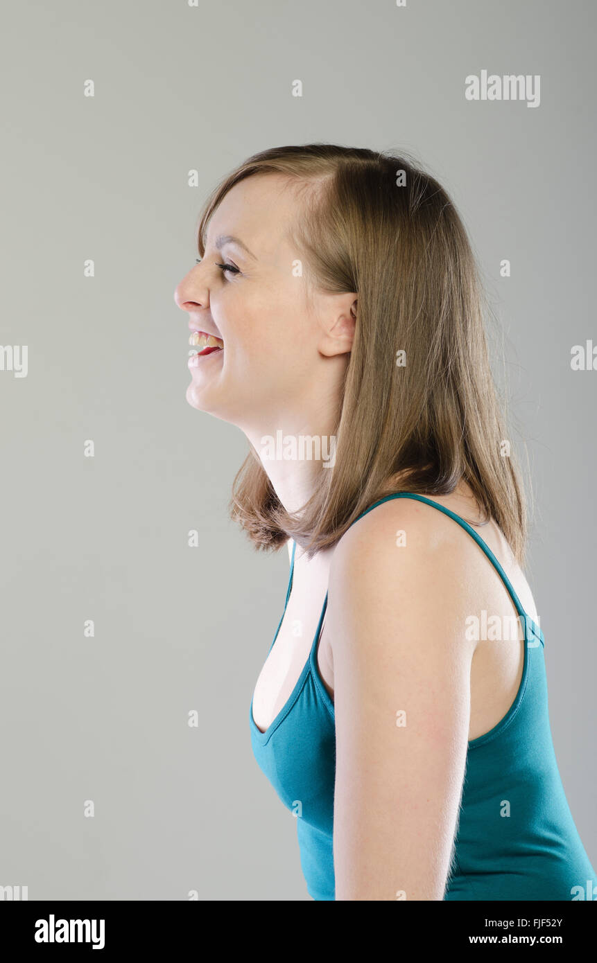 Side view portrait of a happy woman laughing Stock Photo - Alamy