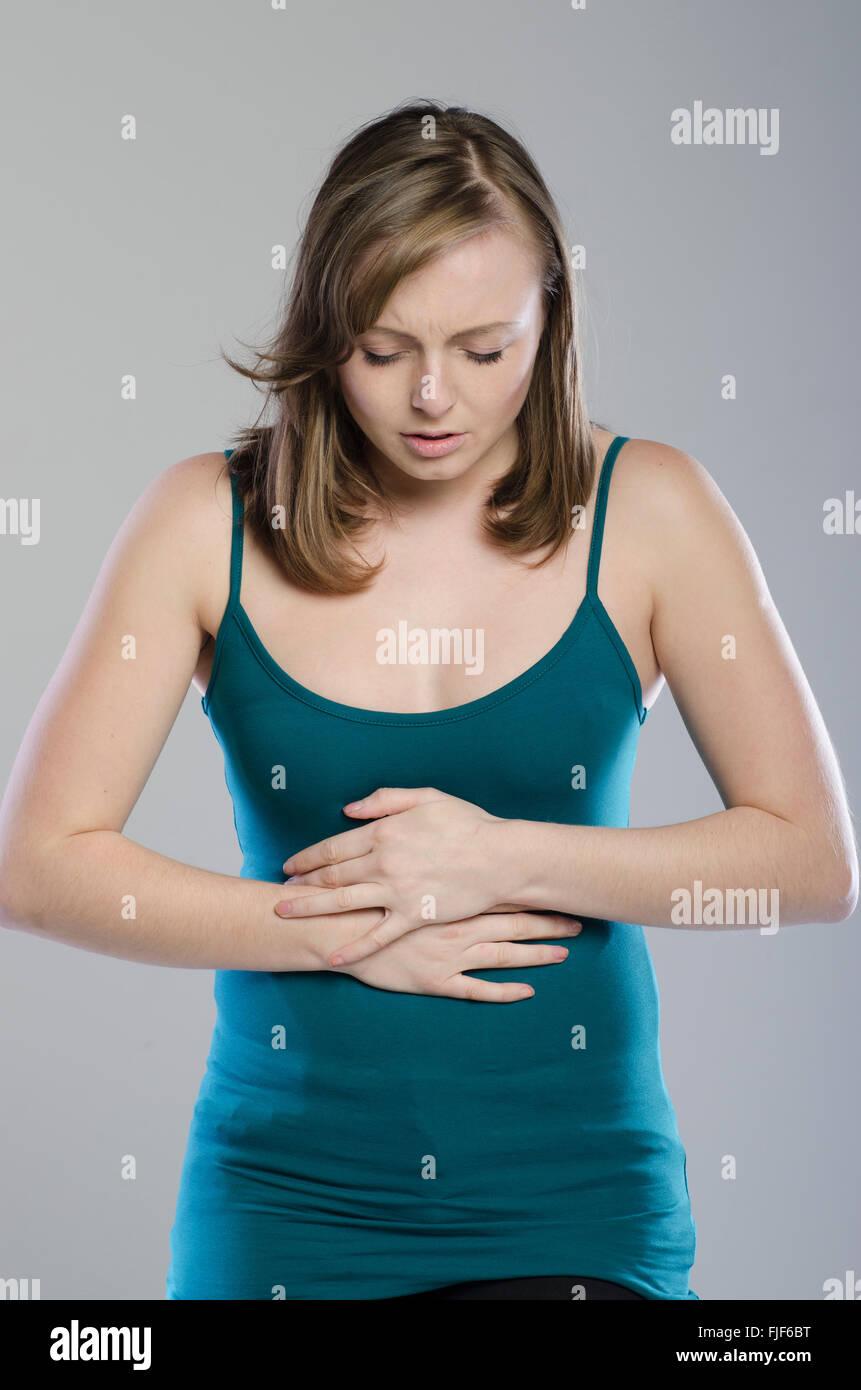 Woman belly ache hi-res stock photography and images - Alamy