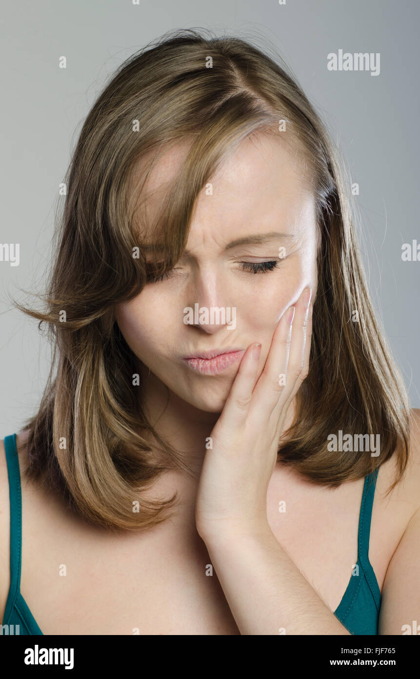 Young woman with toothache Stock Photo - Alamy