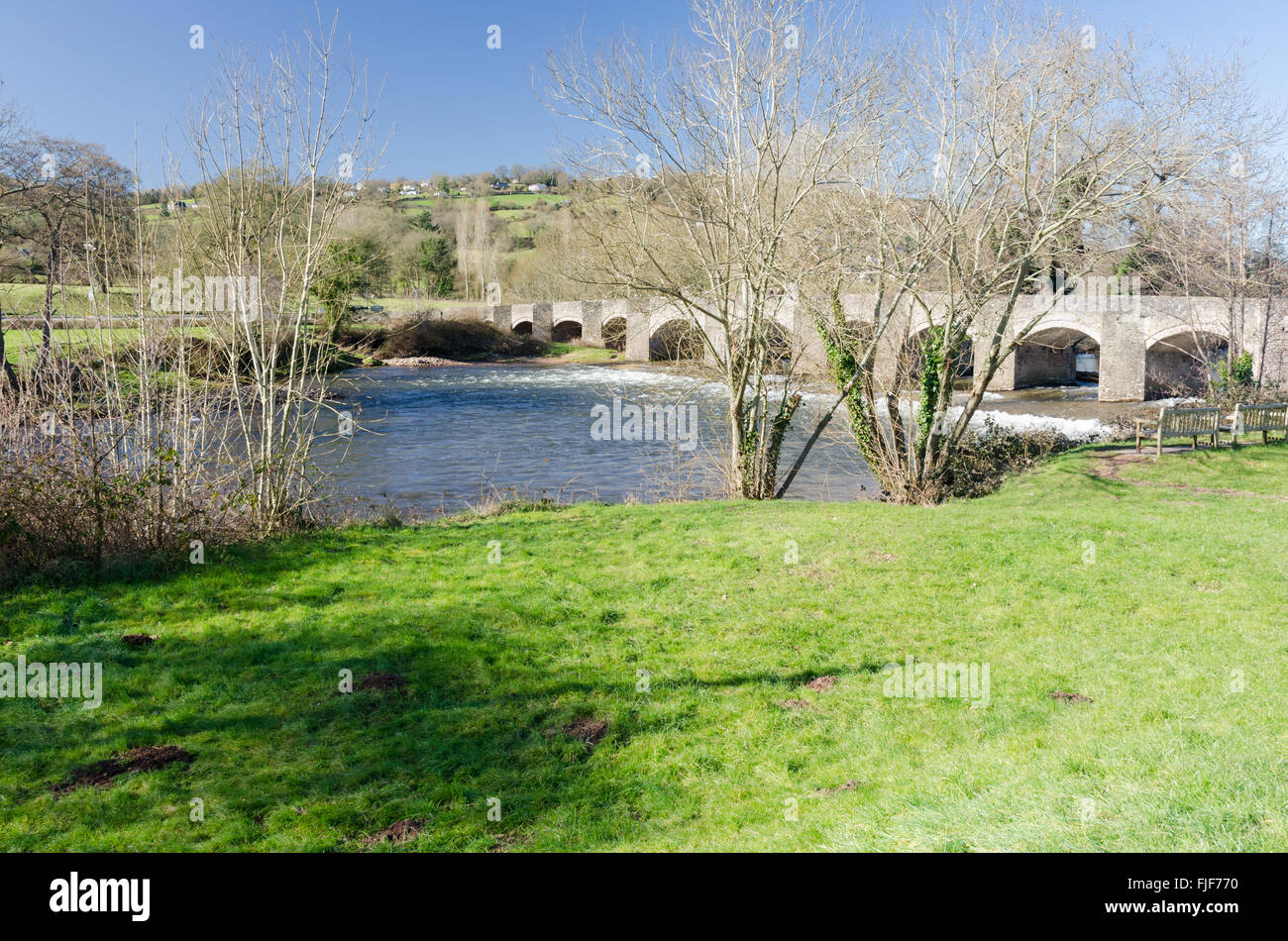 The River Usk flowing through Crickhowell, Powys on a sunny spring day ...