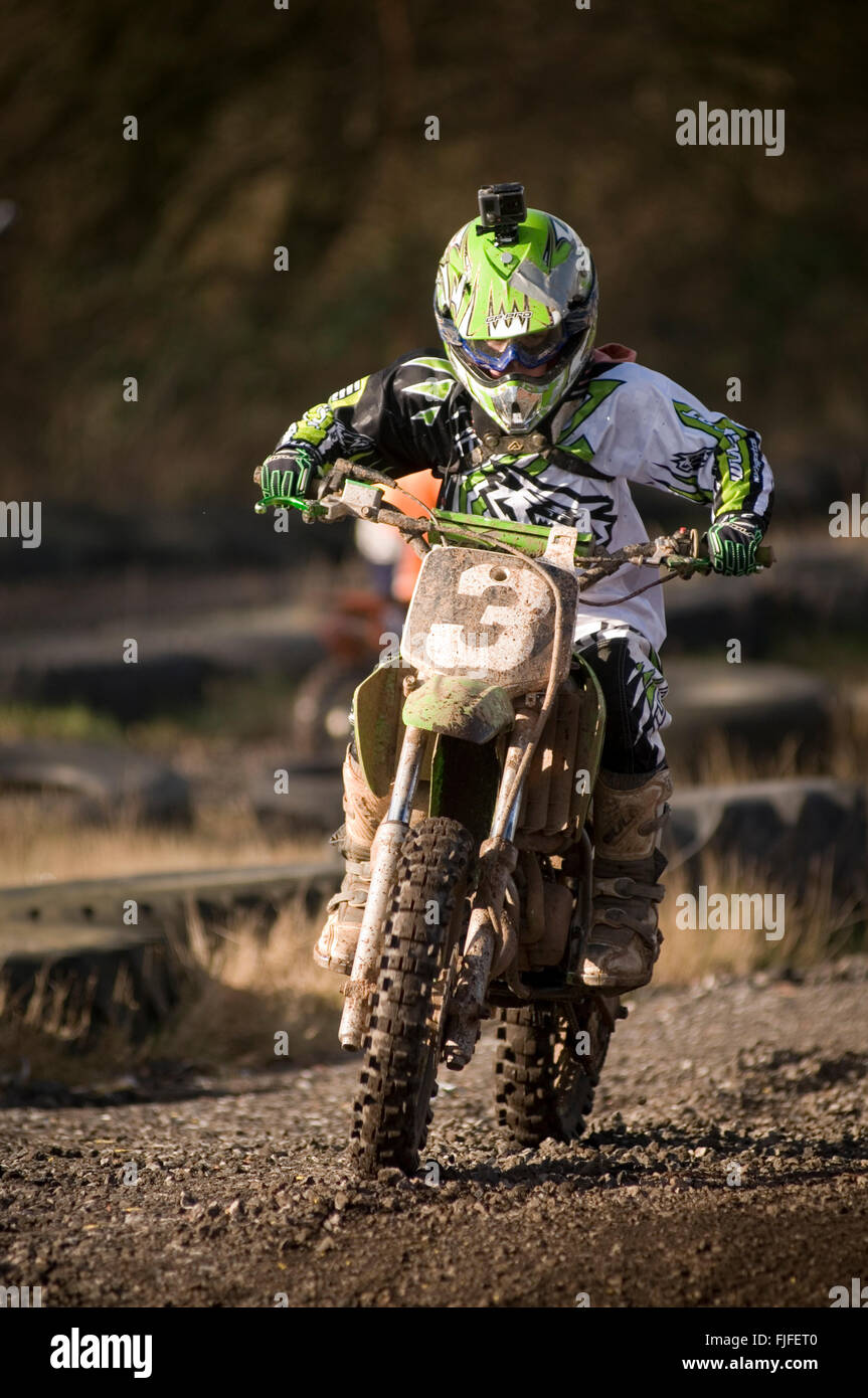 junior moto cross X child rider riding a motor motorcross bike bikes ...