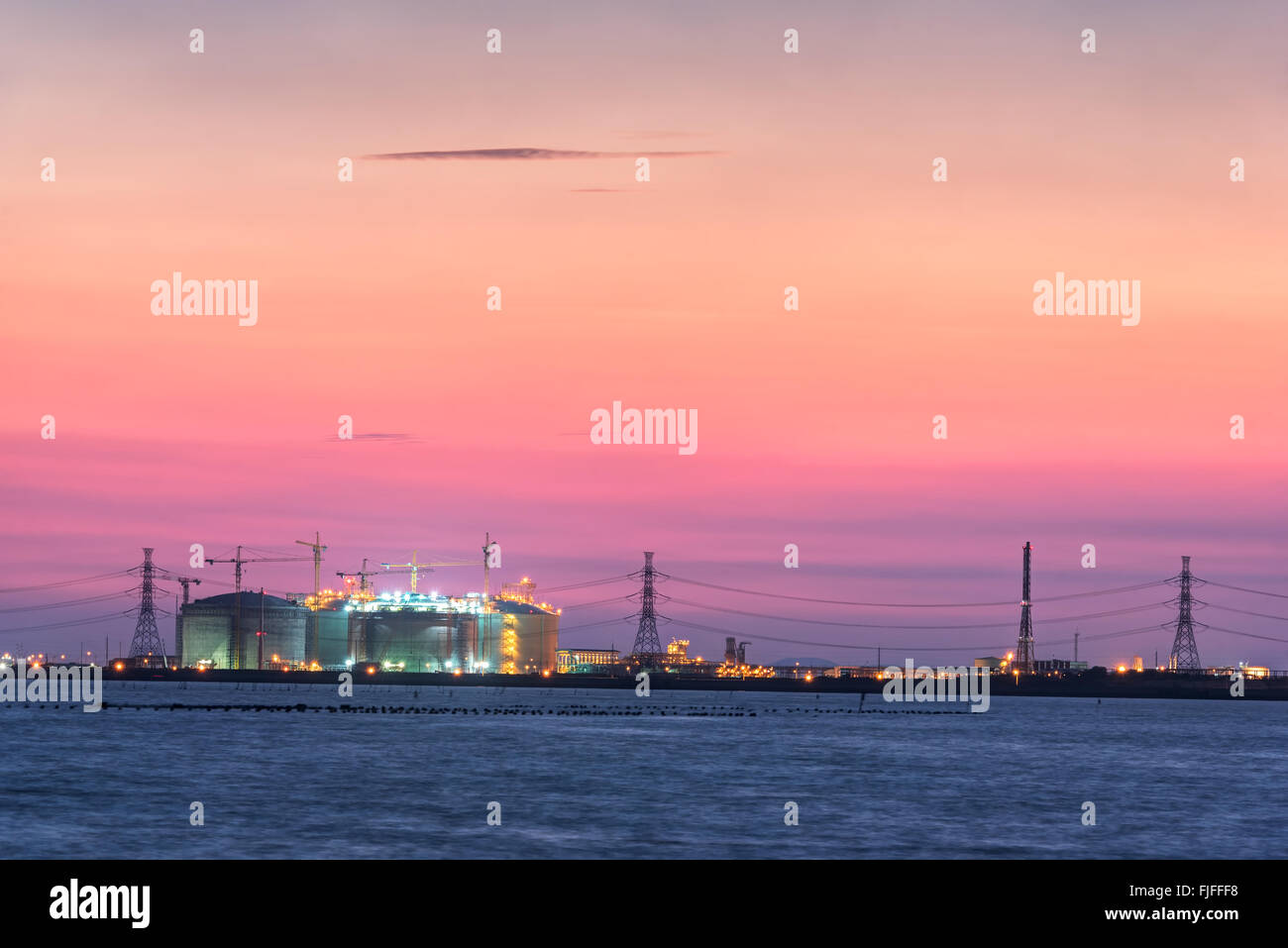Sunset on the power plants Stock Photo - Alamy