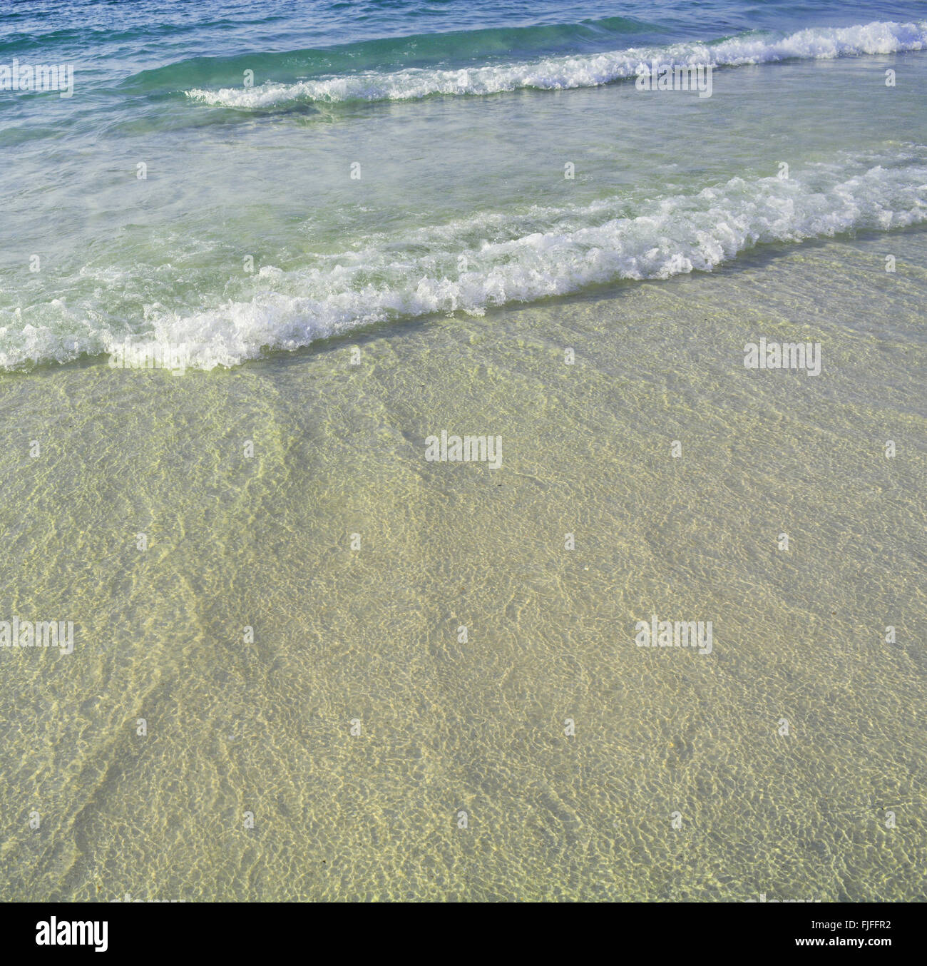 Beach sand sea water closeup Stock Photo - Alamy