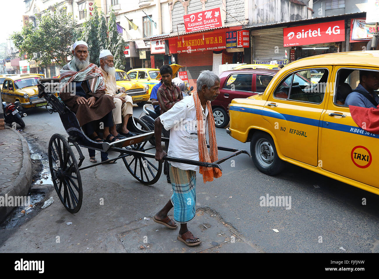 India, 19 February 2016. Hand pulling rickshaw puller pulling with ...