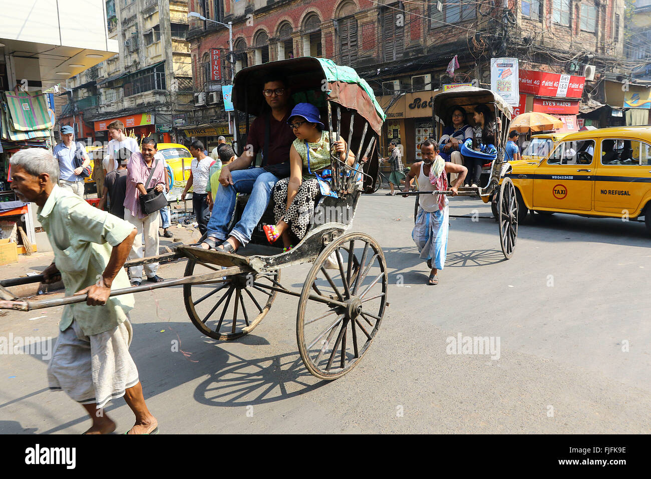 India, 19 February 2016. Hand pulling rickshaw puller pulling with ...