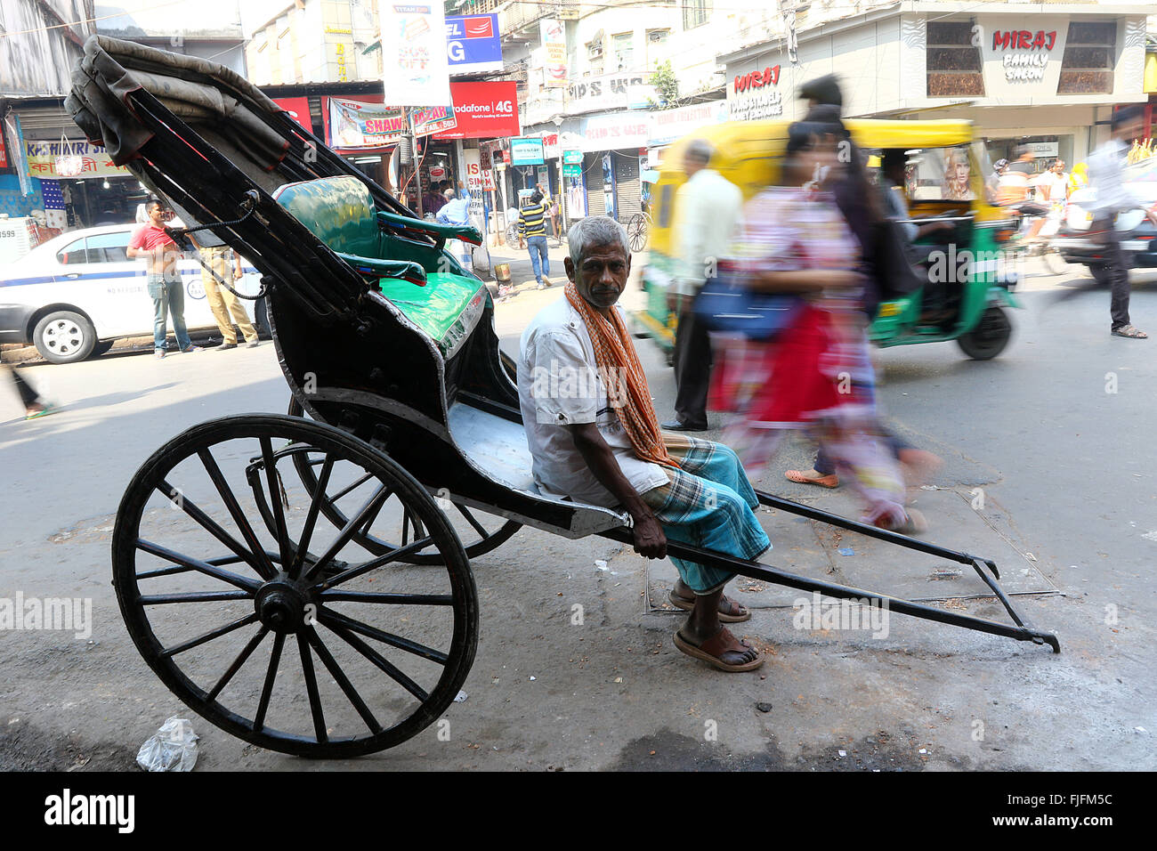 India, 19 February 2016. Hand pulling rickshaw puller waiting for ...