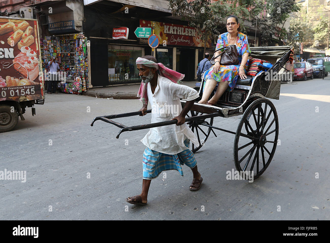 India, 19 February 2016. Hand pulling rickshaw puller pulling with ...