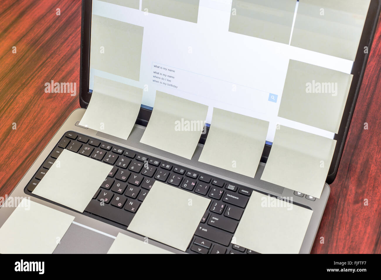 Laptop display covered with yellow sticky notes Stock Photo - Alamy
