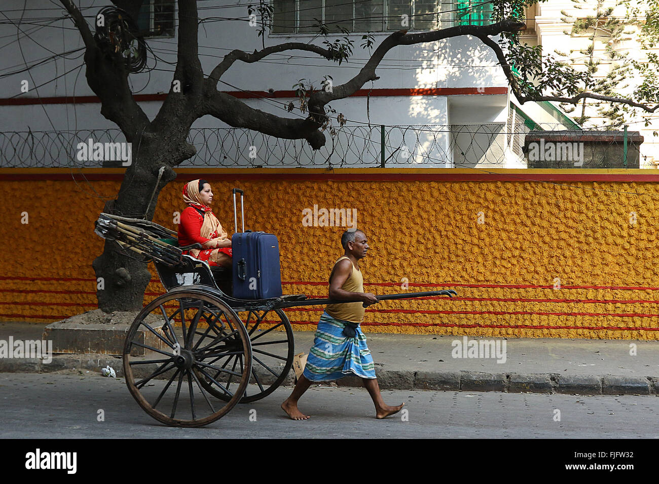 Indian Man Pulling Rickshaw Passenger Stock Photos & Indian Man Pulling ...