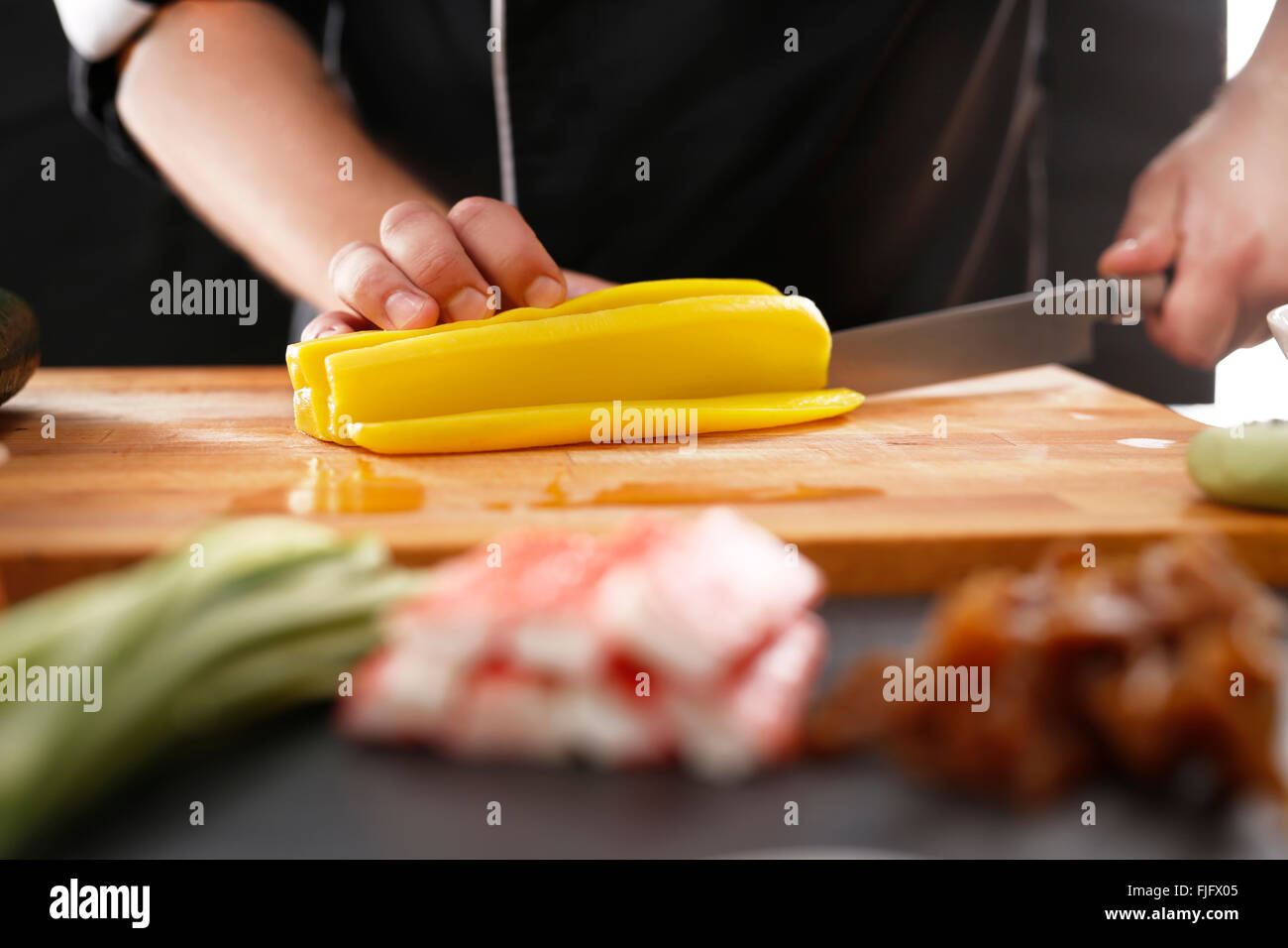 Sushi master preparing sushi in Japanese restaurant. Cuisines of the ...