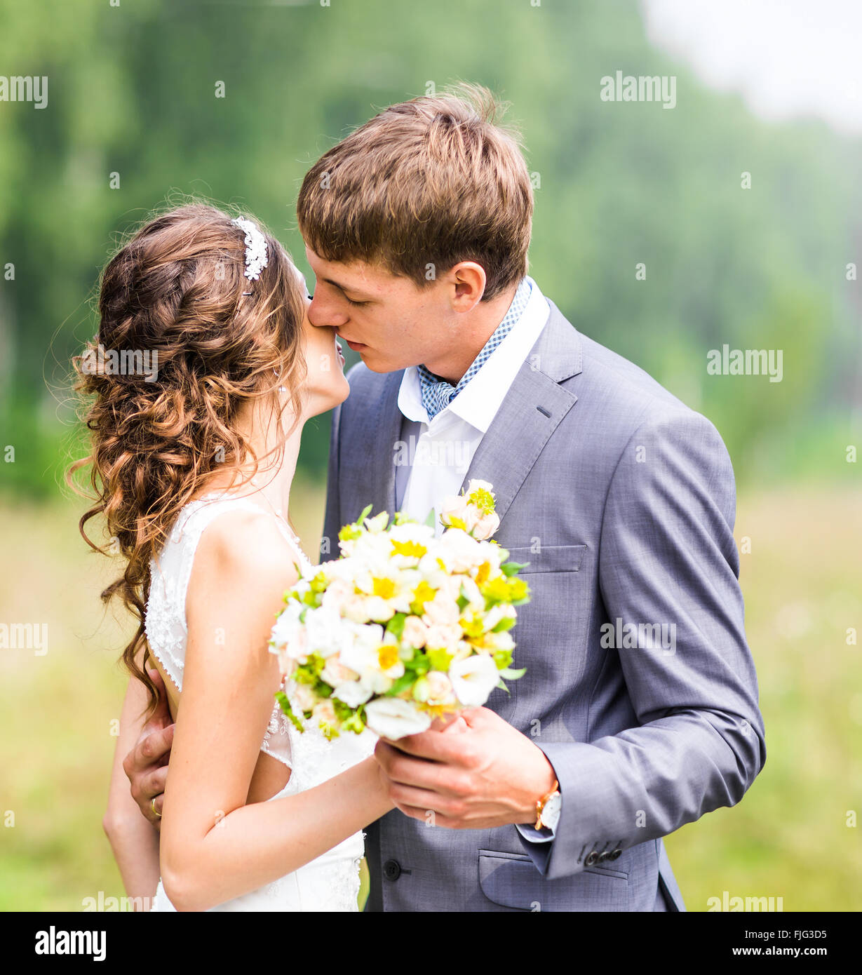 Just married couple embraced Stock Photo - Alamy