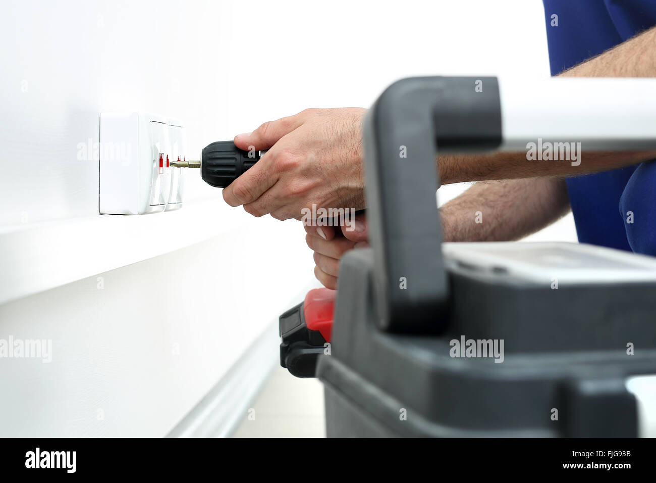 Electrician. Installing Internet. Installation of the wall socket. Man ...