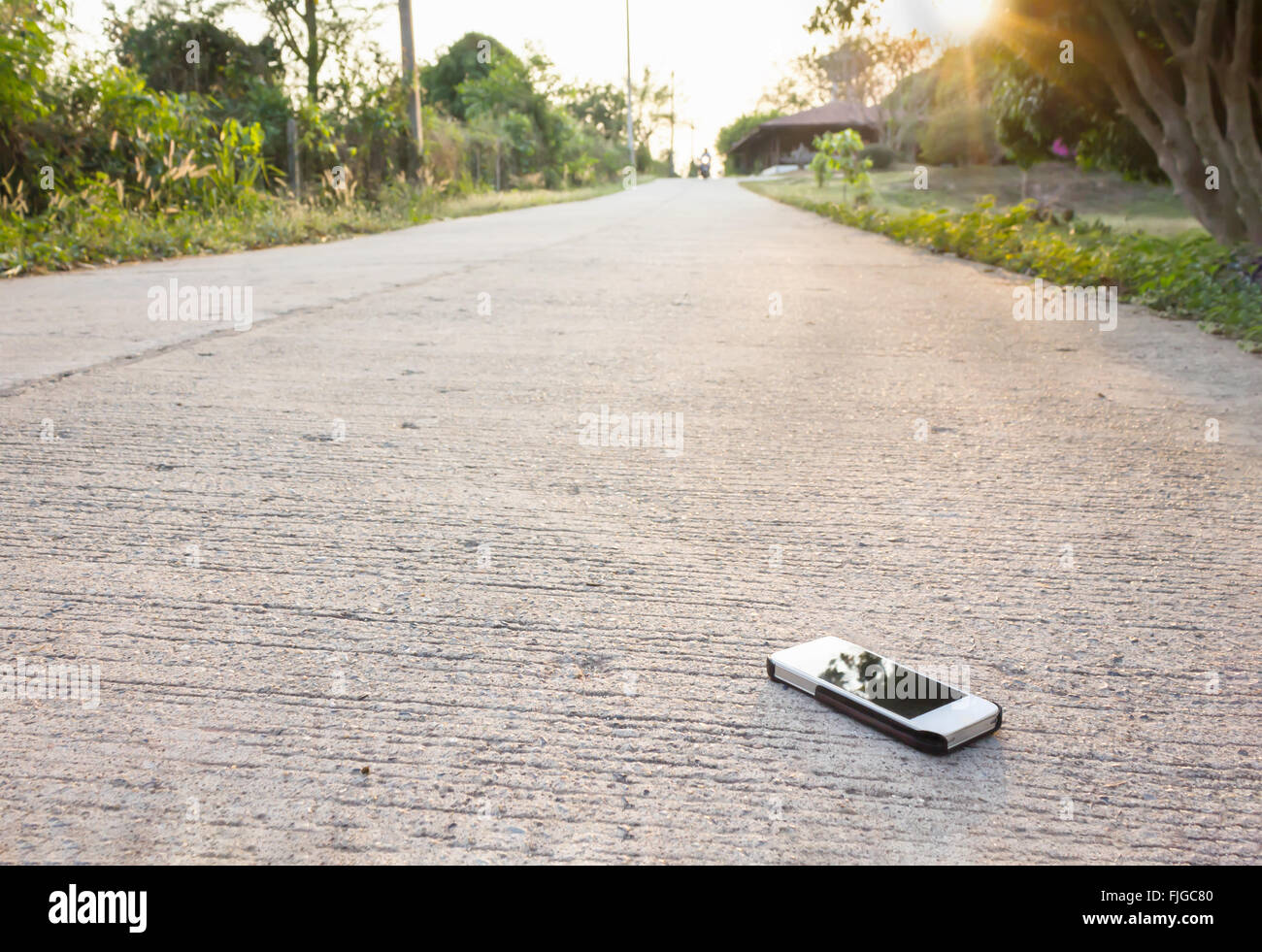 Cellphone drop on the road, missing or lost mobile Stock Photo - Alamy