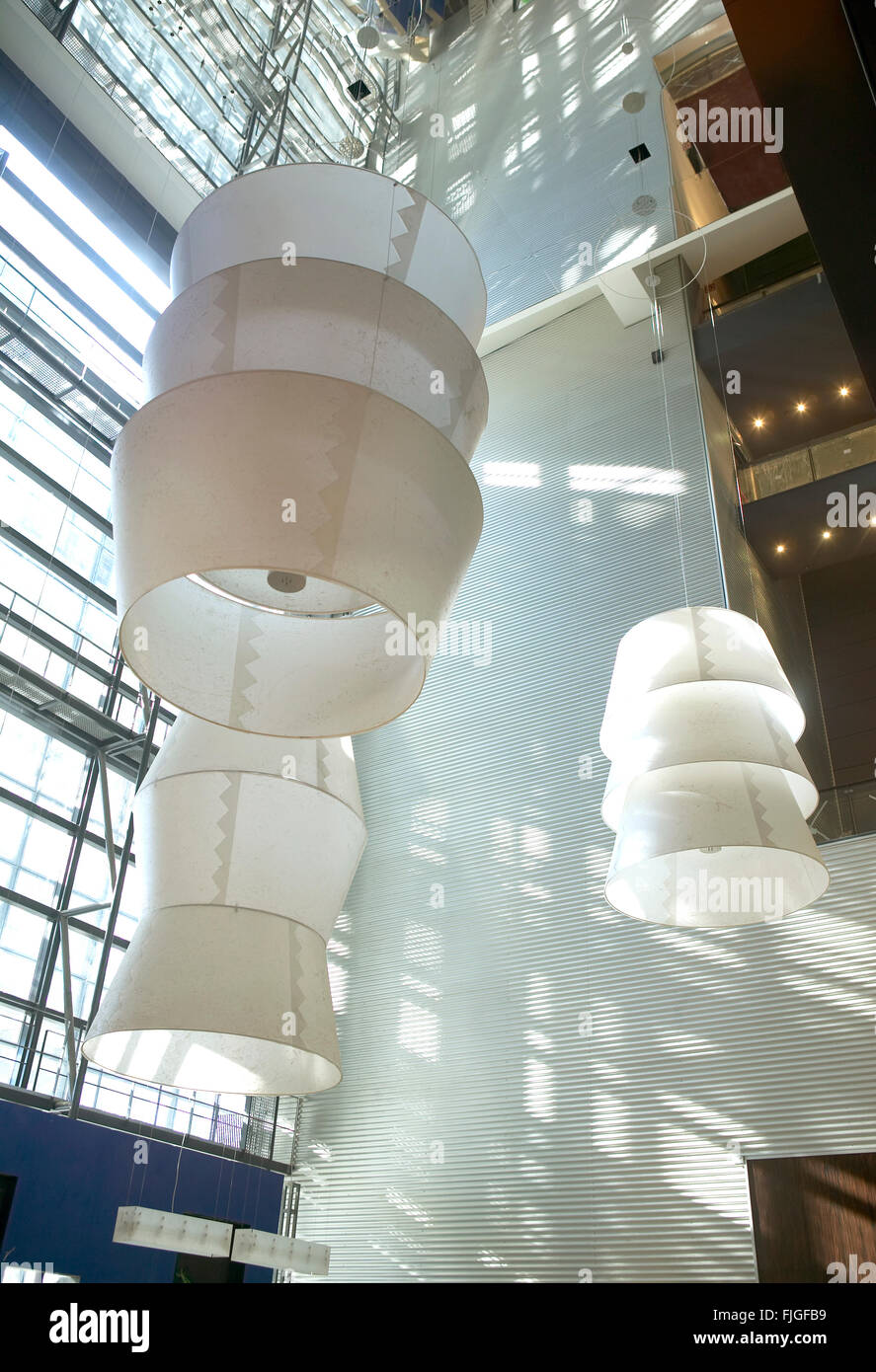 Huge lamps on a modern building interior. Vertical Stock Photo - Alamy