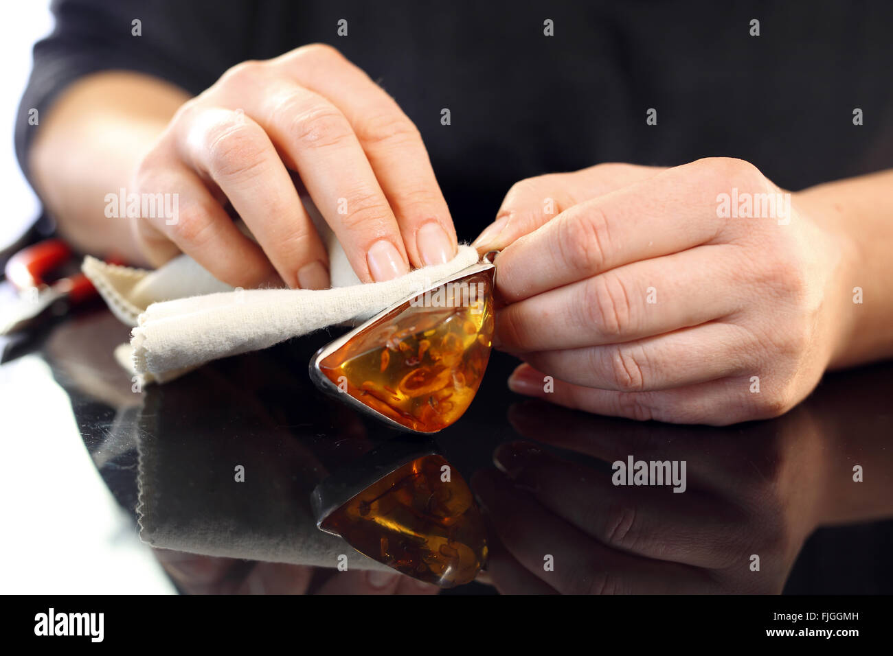 Amber jewelry. Manufactory, a woman carries jewelry made of amber ...