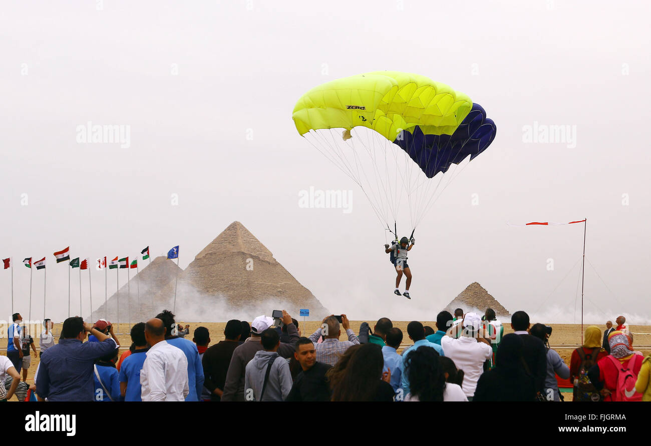 Giza. 2nd Mar, 2016. A parachuter performs on the opening day of the ...