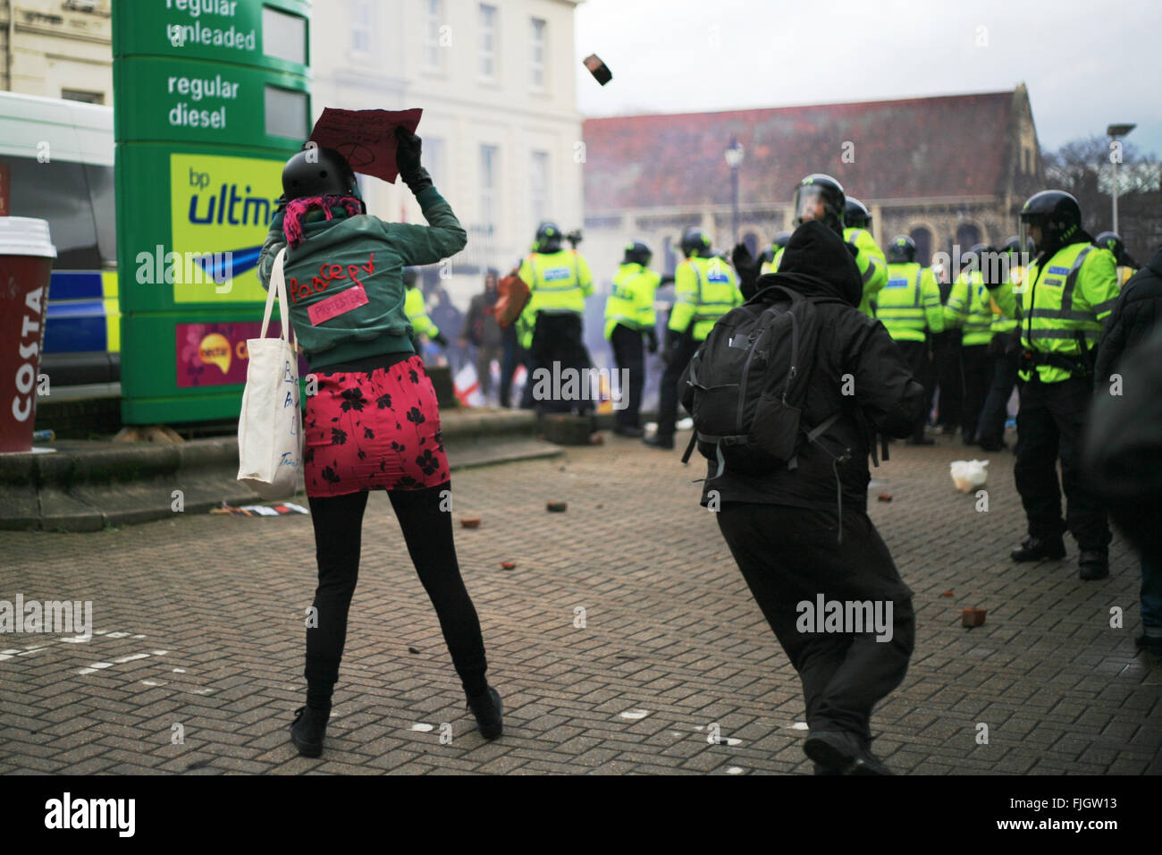 Dover, UK. 30th January, 2016. Anti fascist demonstrator avoids a brick ...