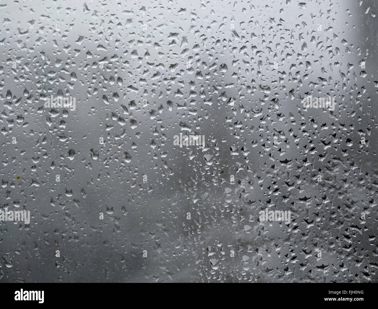 Rain drops on a window glass in Stock Photo - Alamy