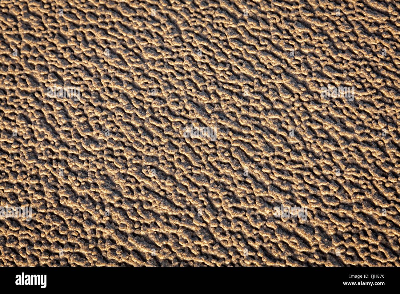 Patterns in beach sand caused by wind and rain Stock Photo - Alamy