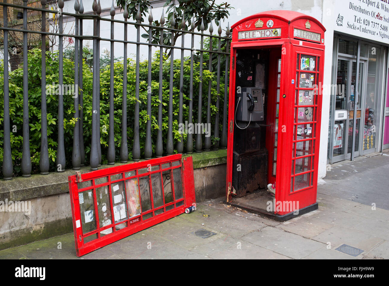 Broken traditional red telephone call box. London, UK. Rarely used ...