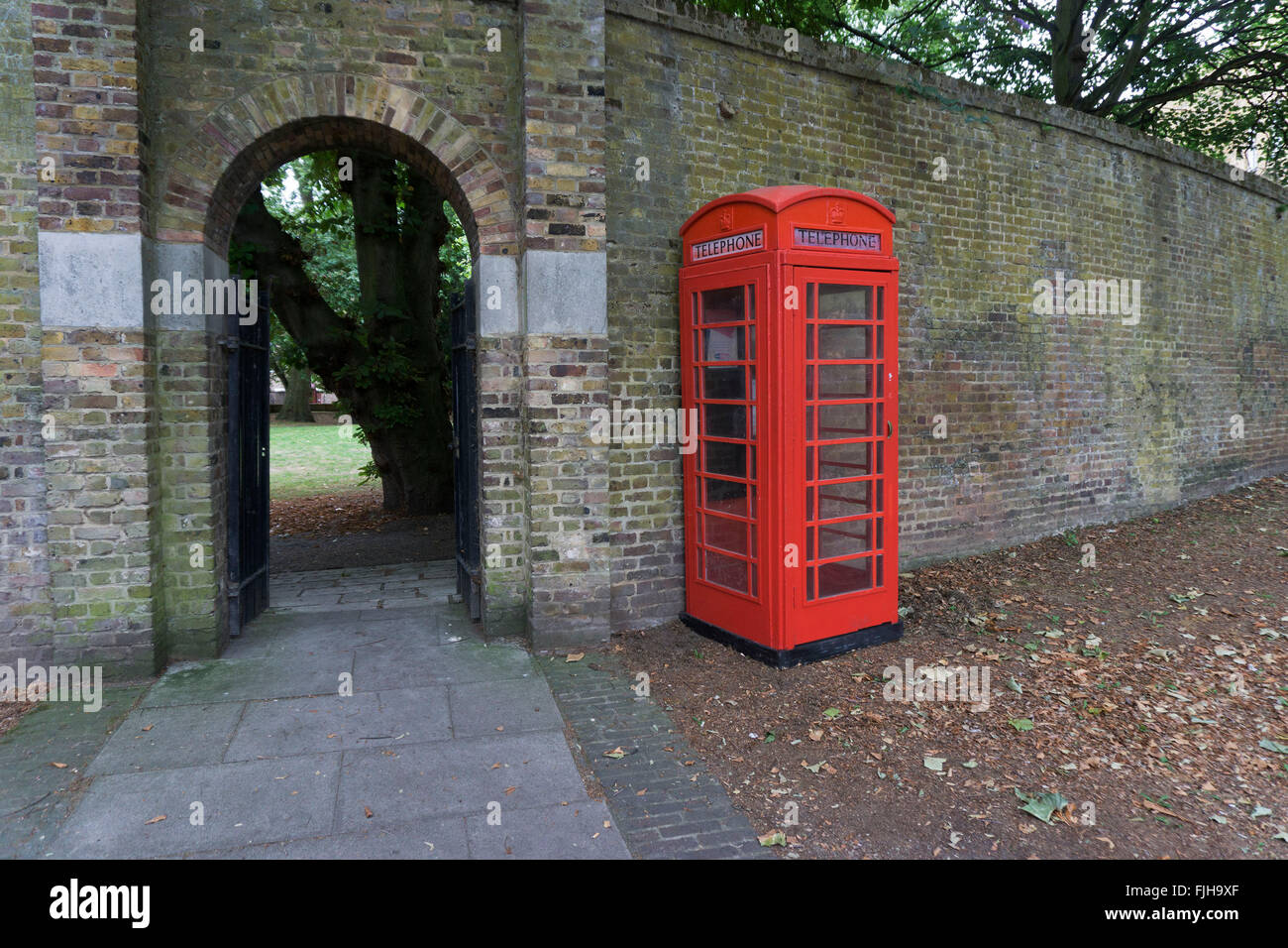 Fake red telephone call box in Wapping, London, UK. This traditional ...