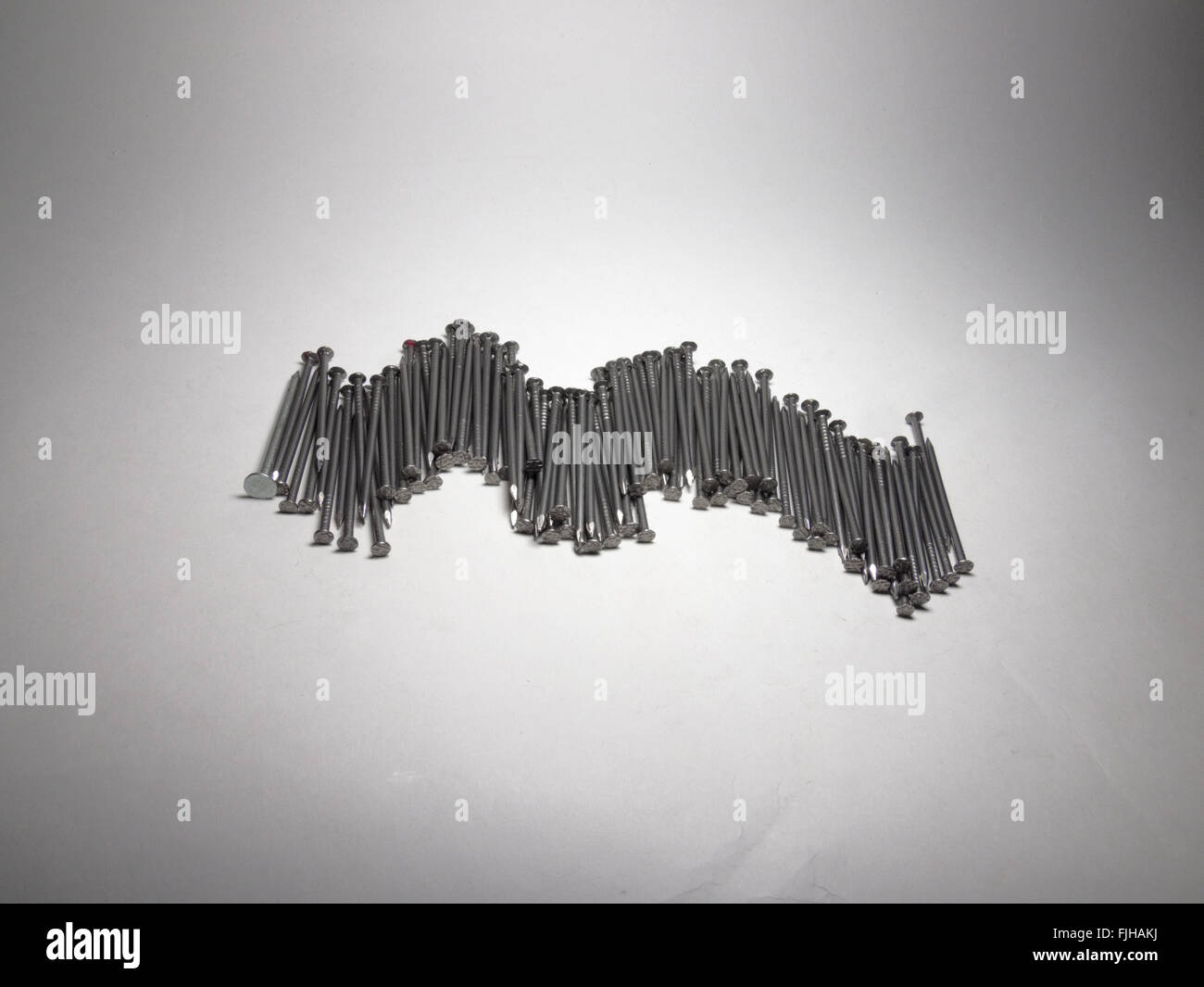 Nails, intricately laid out. Symbol Stock Photo - Alamy