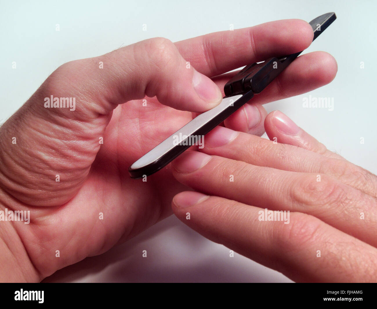 Mans hand on manicure hi-res stock photography and images - Alamy
