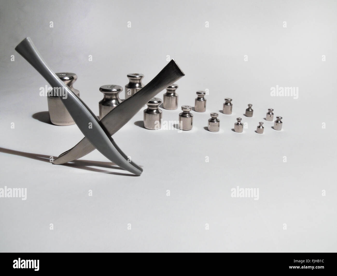 a set of laboratory weights, steel and plastic tweezers Stock Photo - Alamy