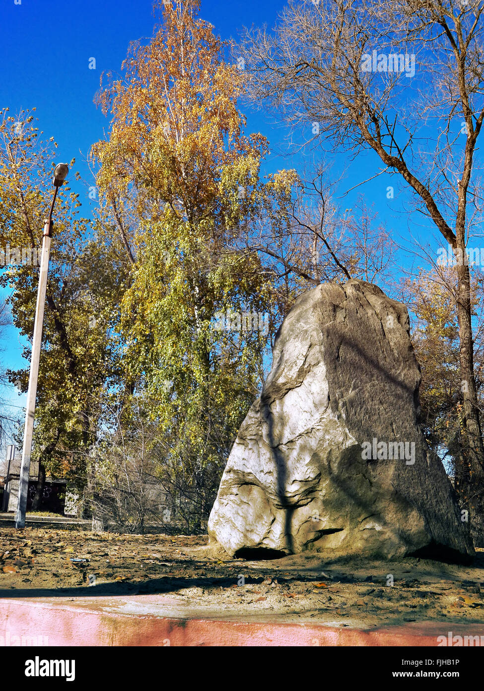The Stone monument beside the road Stock Photo - Alamy