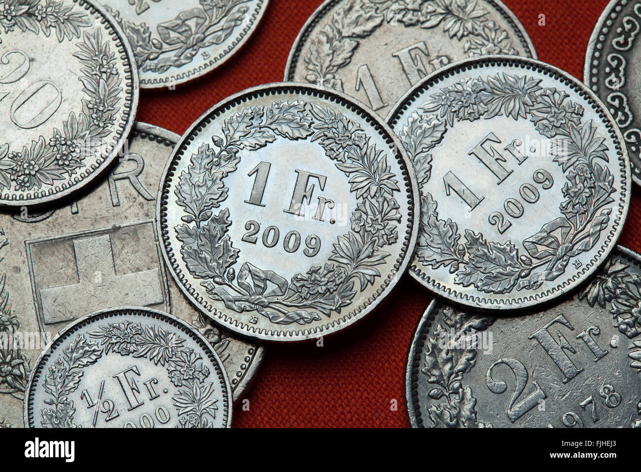 Coins of Switzerland. Swiss one franc coins Stock Photo - Alamy