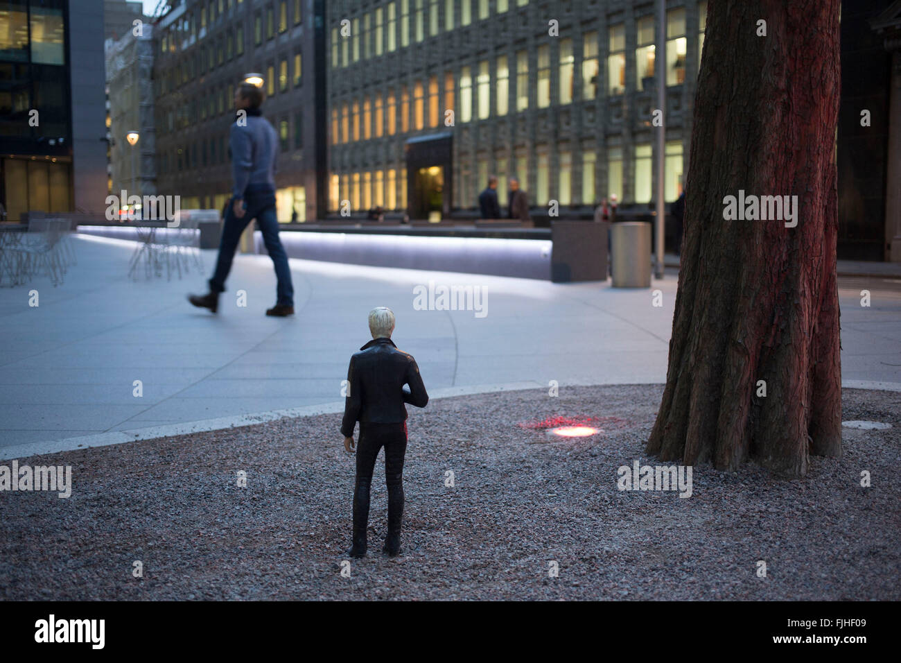 Miniature statue of a man in the City of London, UK. These tiny public ...