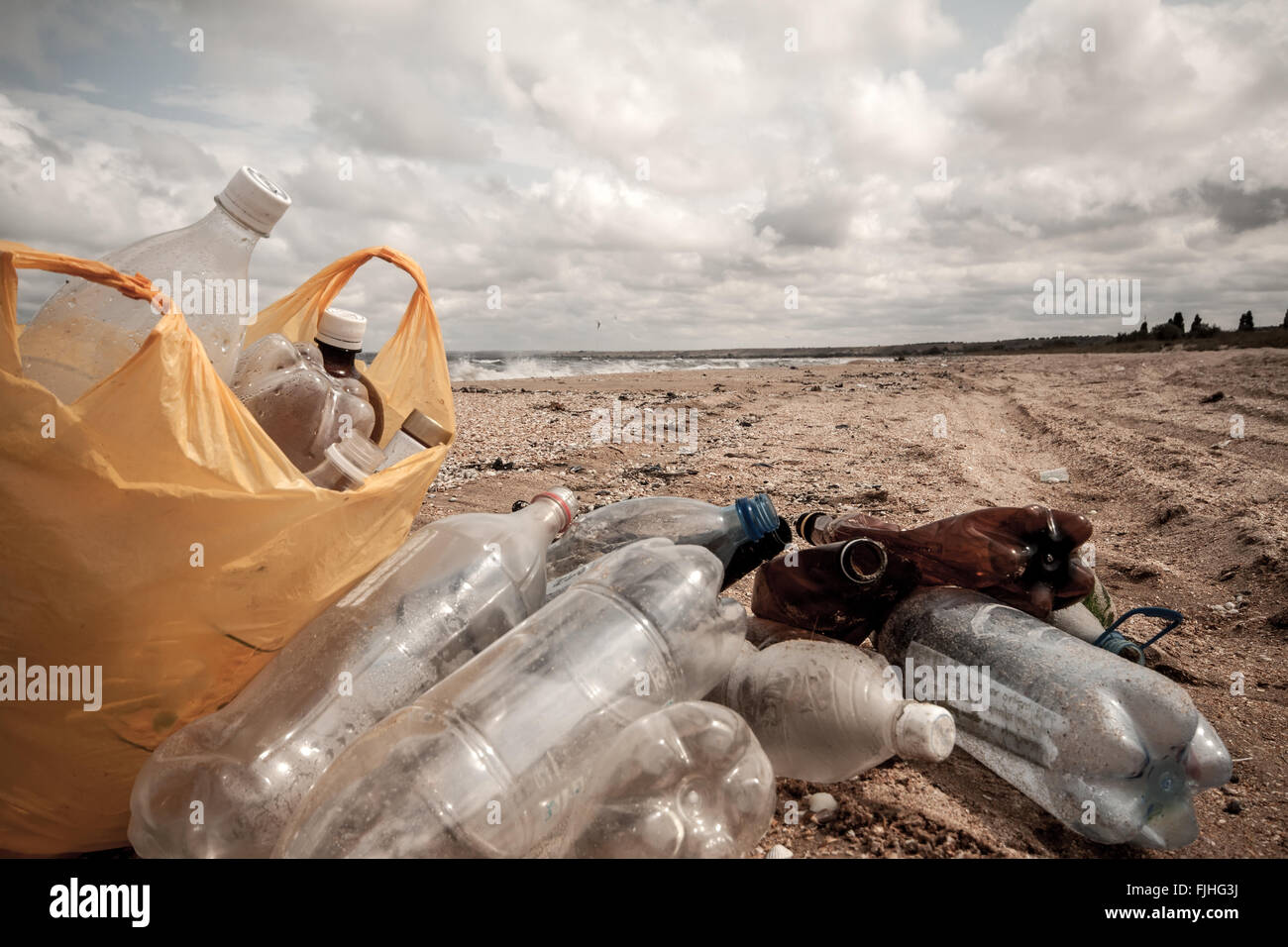 Dirty sea beach Stock Photo - Alamy